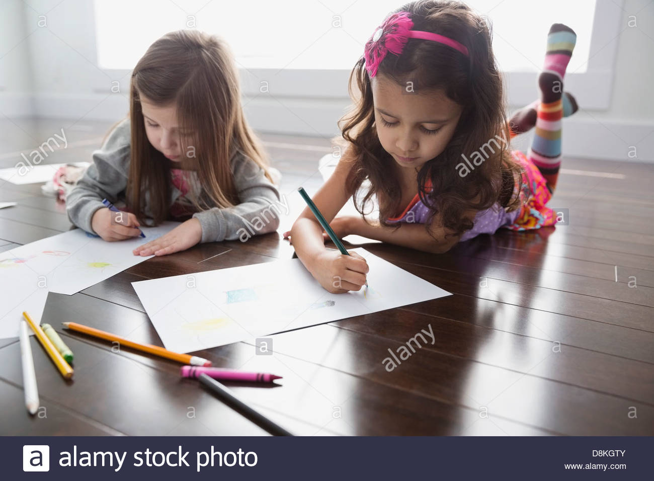 Girls lying on floor drawing hi-res stock photography and images - Alamy