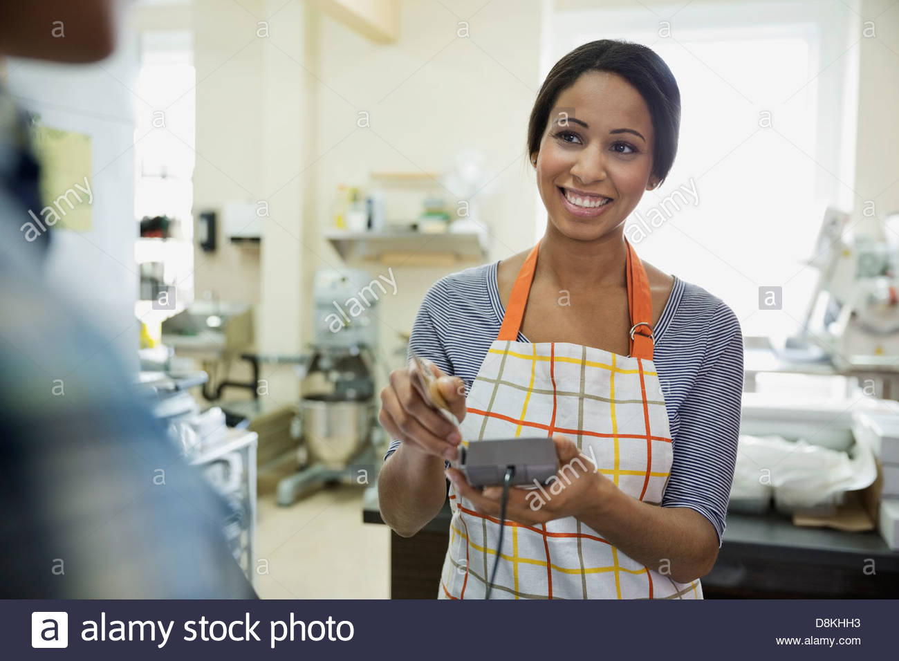 Woman baker payment hi-res stock photography and images - Alamy