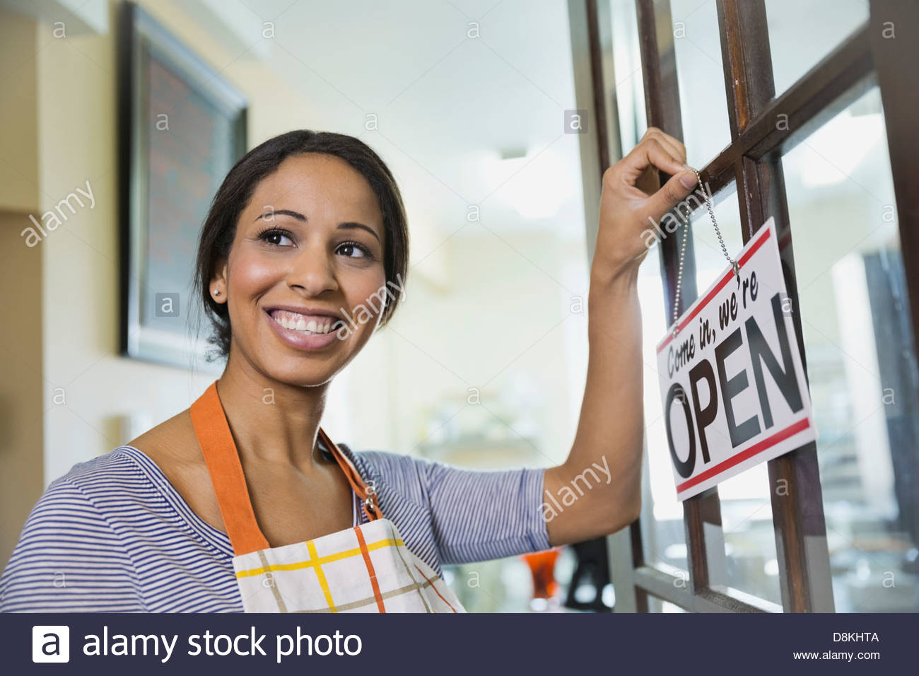 Women hanging open sign hi-res stock photography and images - Alamy