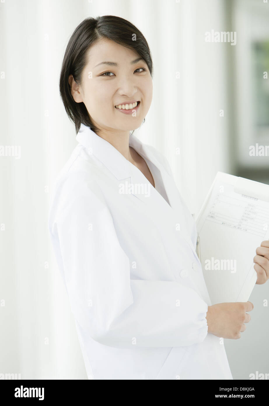 Woman doctor smiling Stock Photo - Alamy