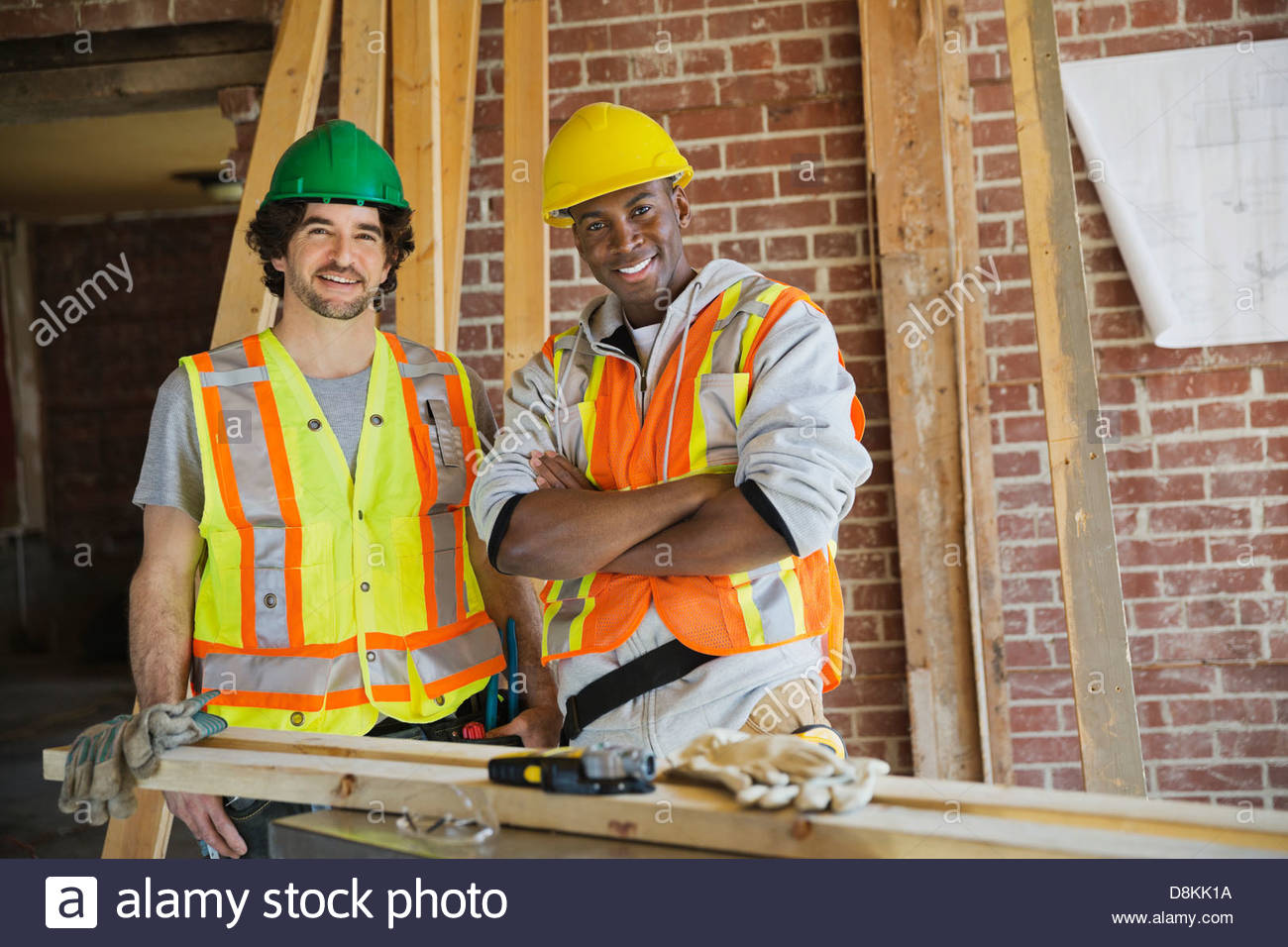 Portrait of tradesmen at construction site Stock Photo - Alamy