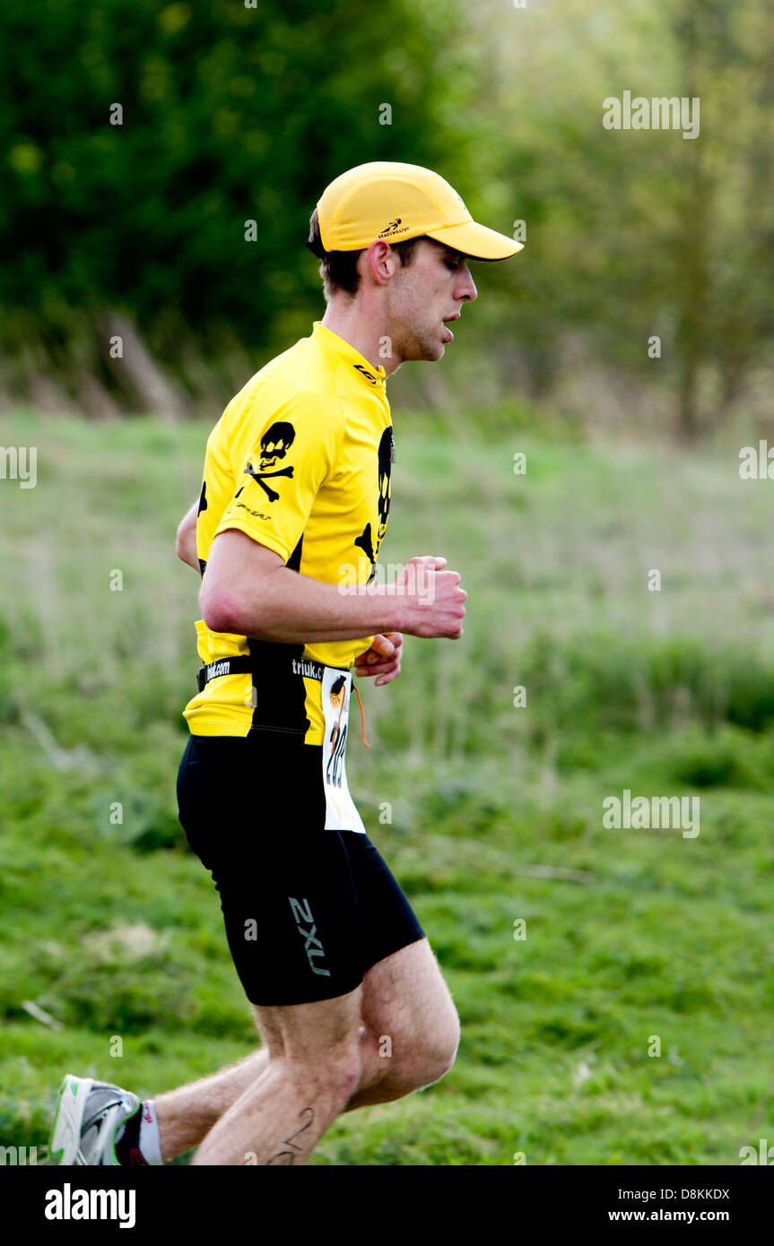 Man running in 2013 Stratford 220 Triathlon Stock Photo - Alamy