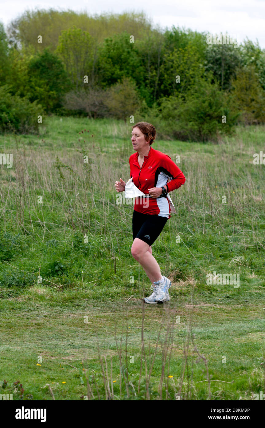 Female triathlete running hi-res stock photography and images - Alamy