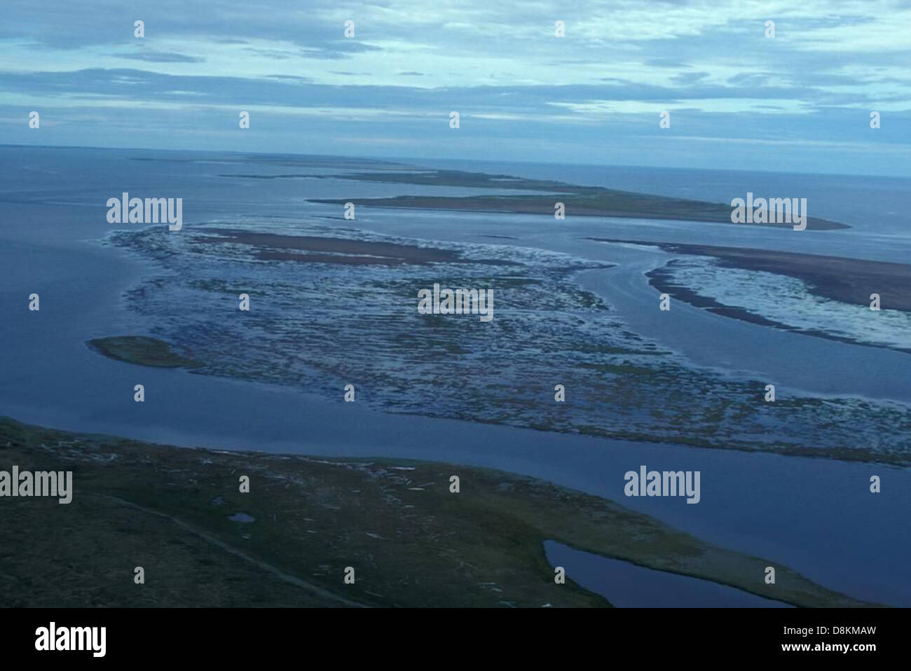 A scenic view of barrier islands and lagoons near Cape Espenberg. The ...