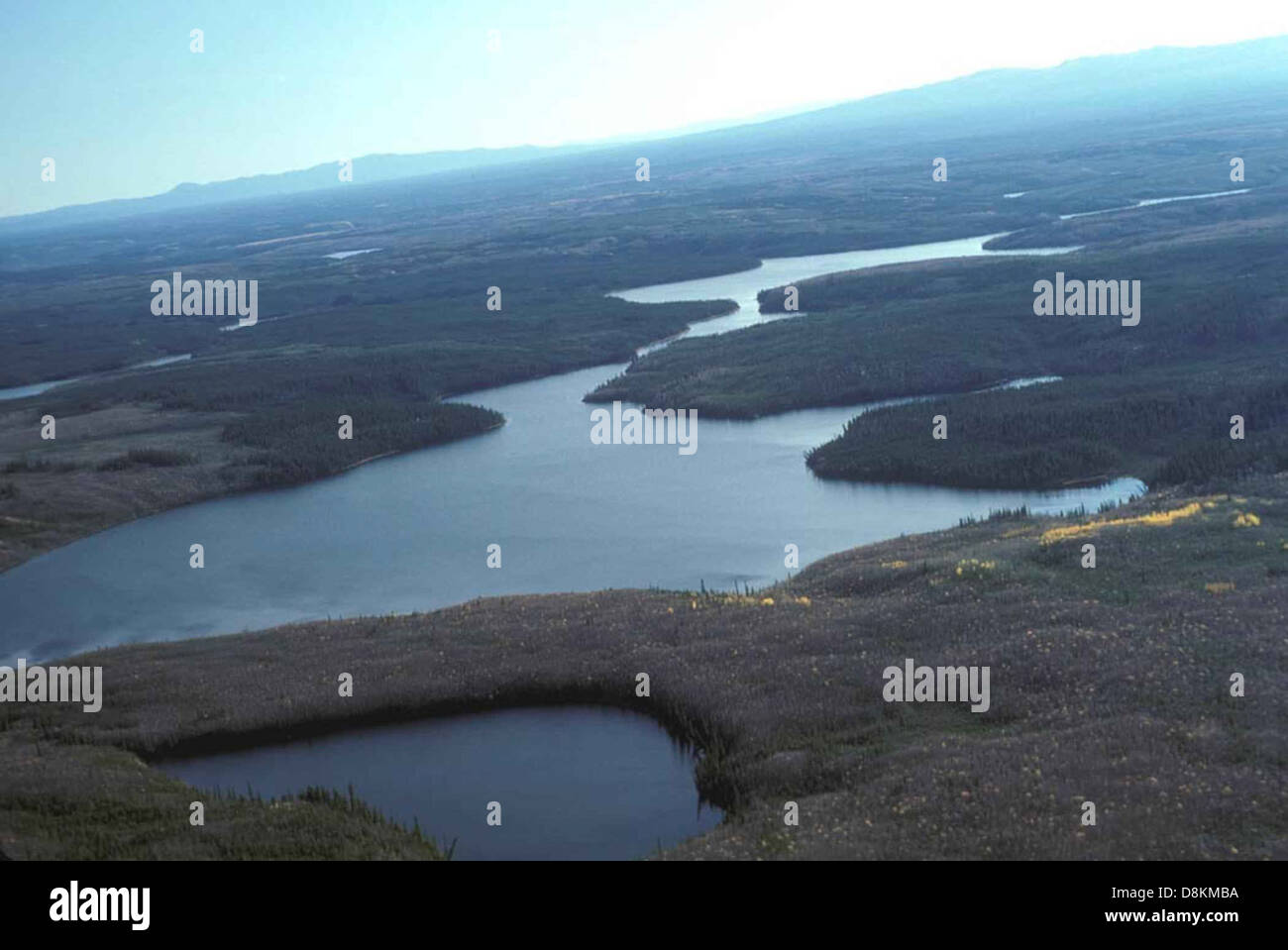 A stunning landscape of two connected lakes, surrounded by mountains ...