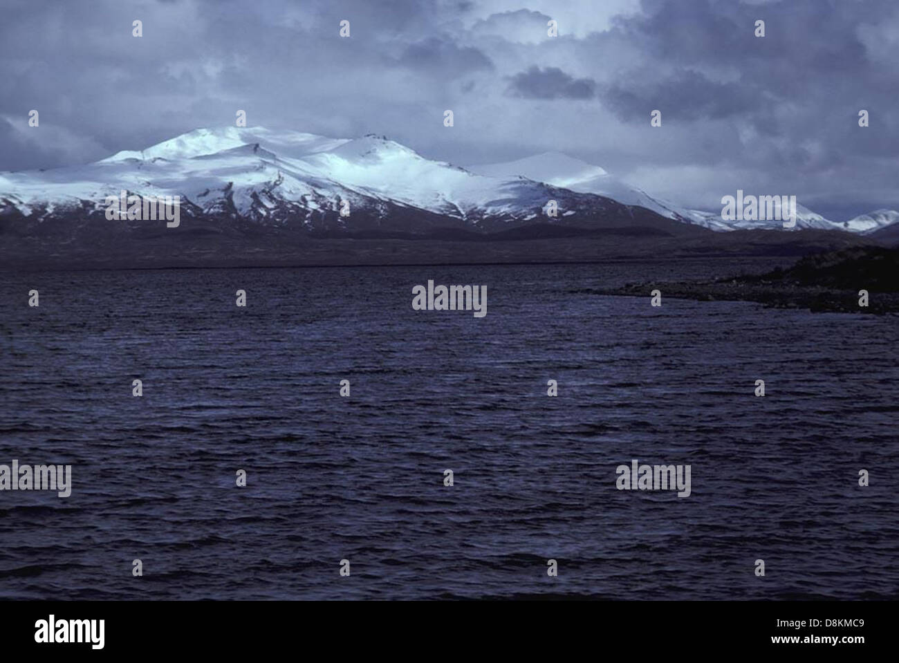 A view of Becharof Lake, located in Alaska, surrounded by rugged ...