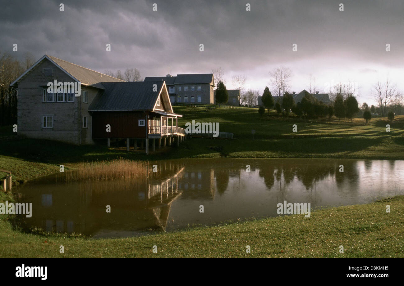 A group of cabin-like buildings in a rural or mountainous area ...
