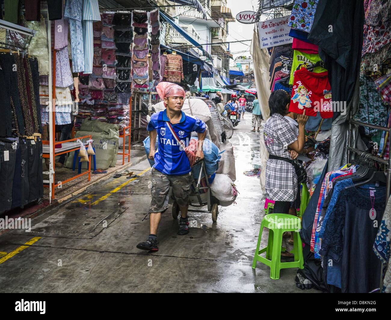 May 31, 2013 - Bangkok, Thailand - A porter delivers clothes to a ...