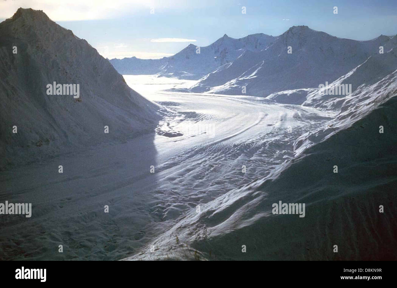 This aerial photograph showcases a glacier, with its vast ice field and ...