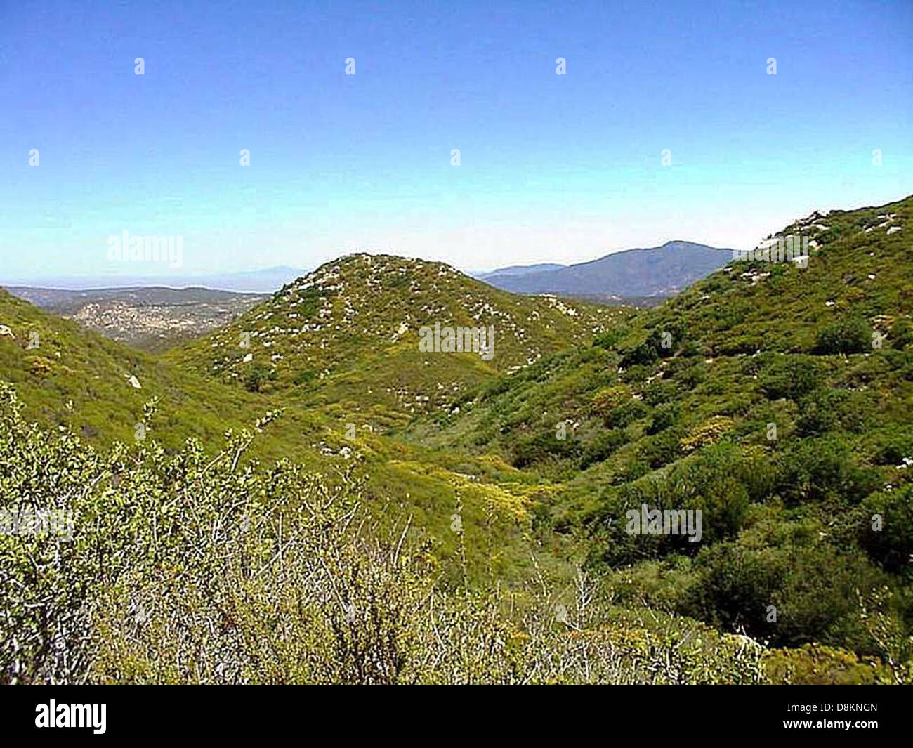 Green hills are depicted in this scenic landscape, showcasing the ...