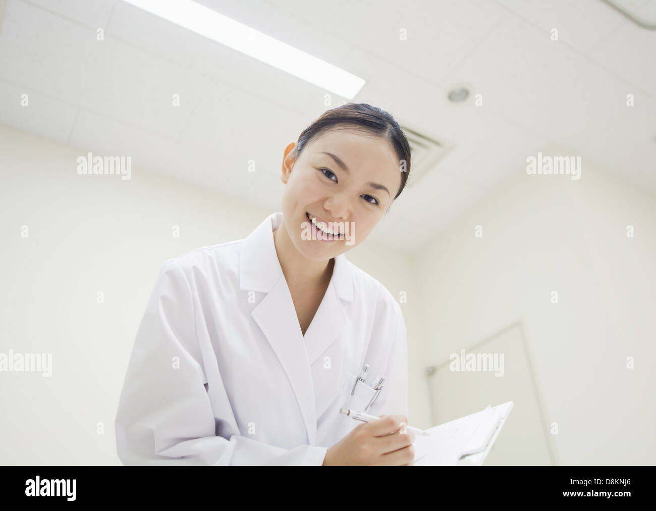 Medical technologist smiling Stock Photo - Alamy