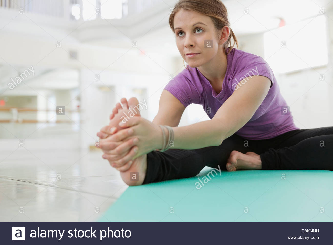 Woman stretching full body studio hi-res stock photography and images ...