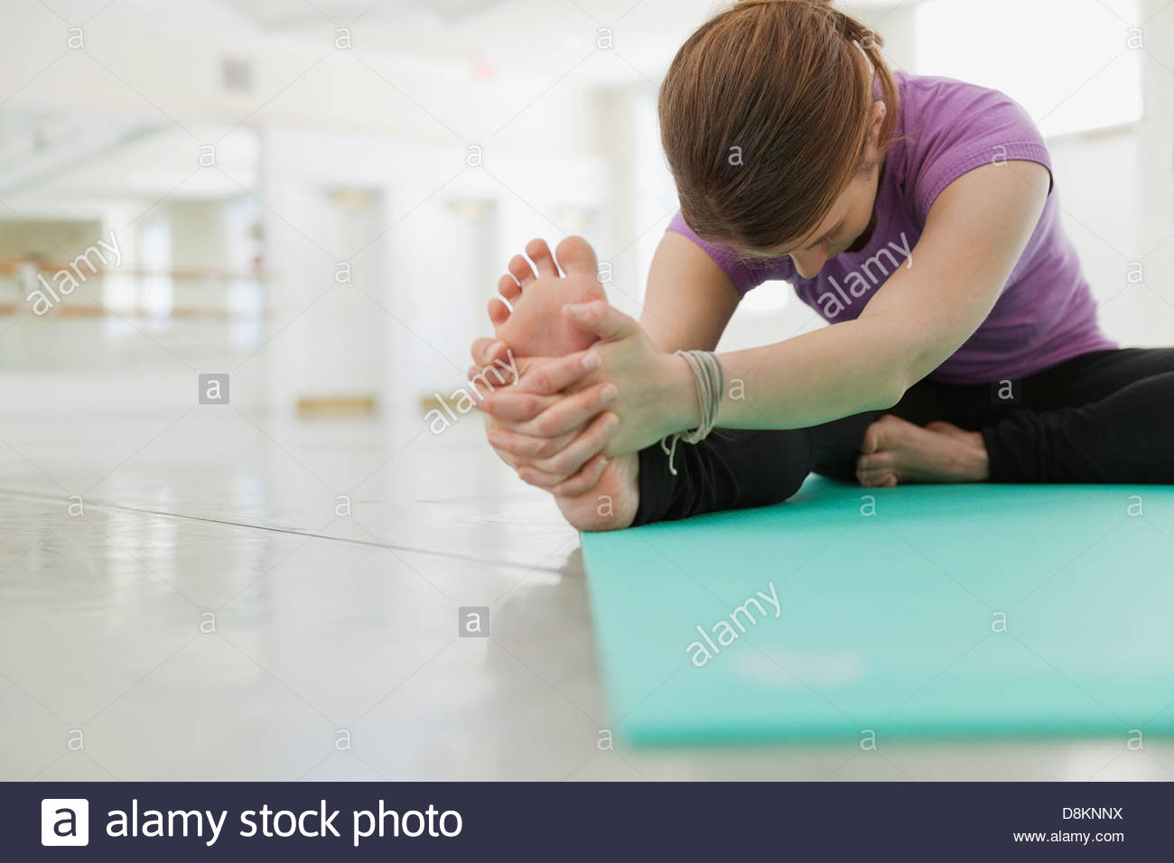Woman stretching full body studio hi-res stock photography and images ...