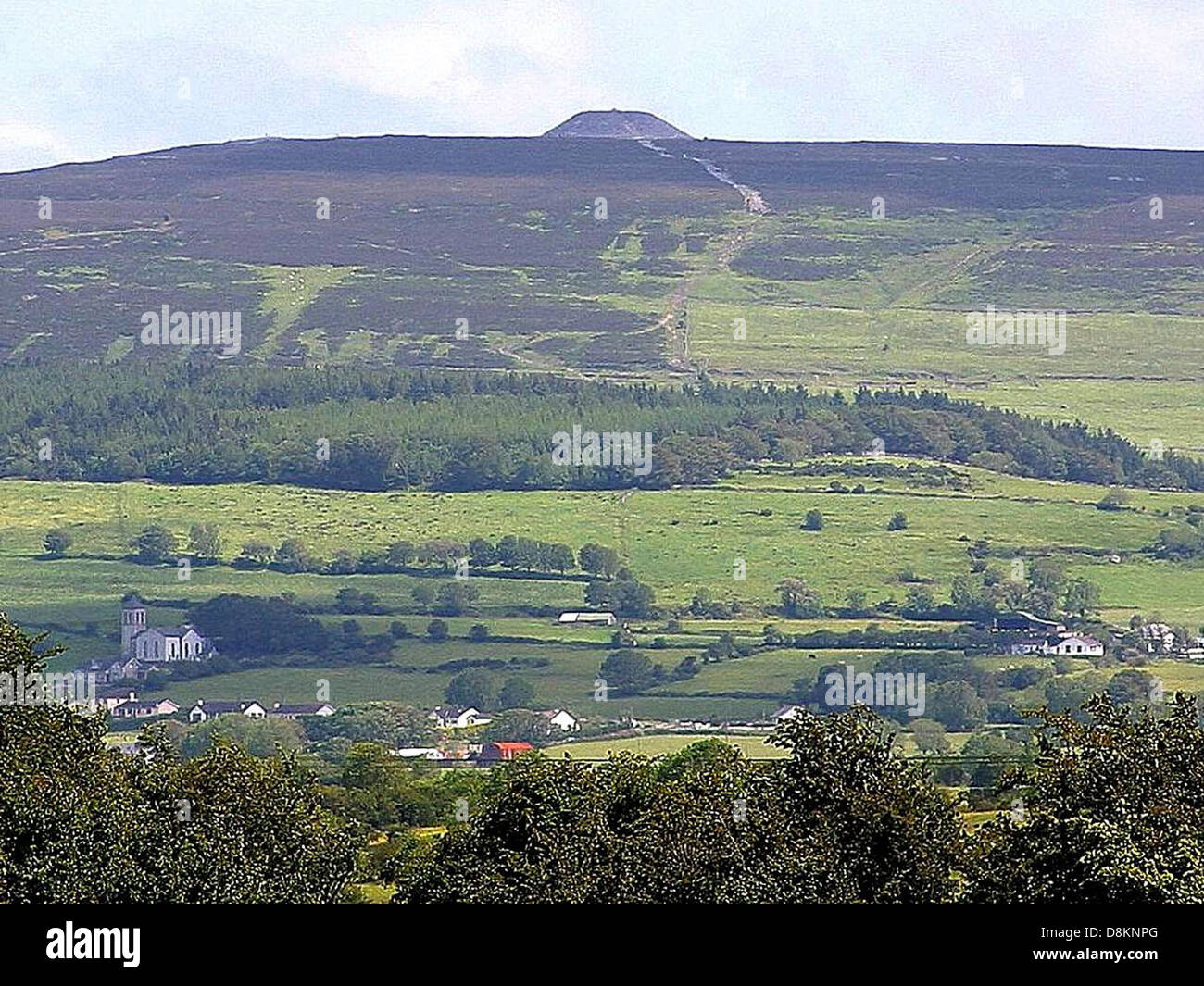 Rolling hills in the countryside, featuring lush green fields and a ...