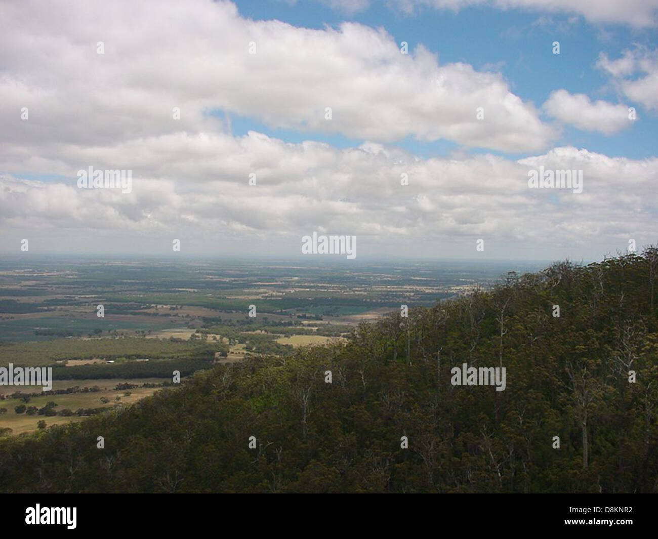 A wide panoramic view of a rocky hill landscape, featuring rugged ...