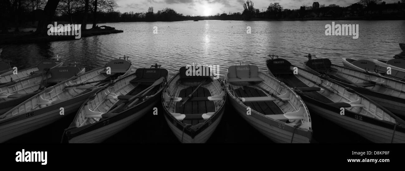 Colourful wooden rowing boats for hire on the Mere lake, Thorpeness ...