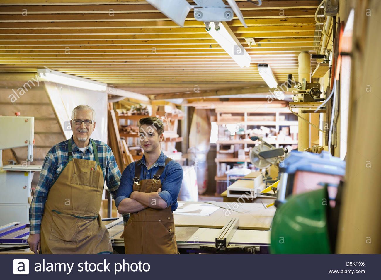 Carpenters standing together in workshop Stock Photo - Alamy