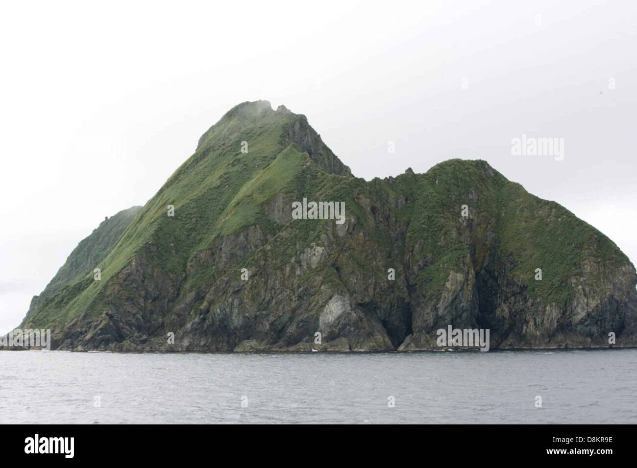 An oceanic ridge is shown rising above the surrounding water, creating ...