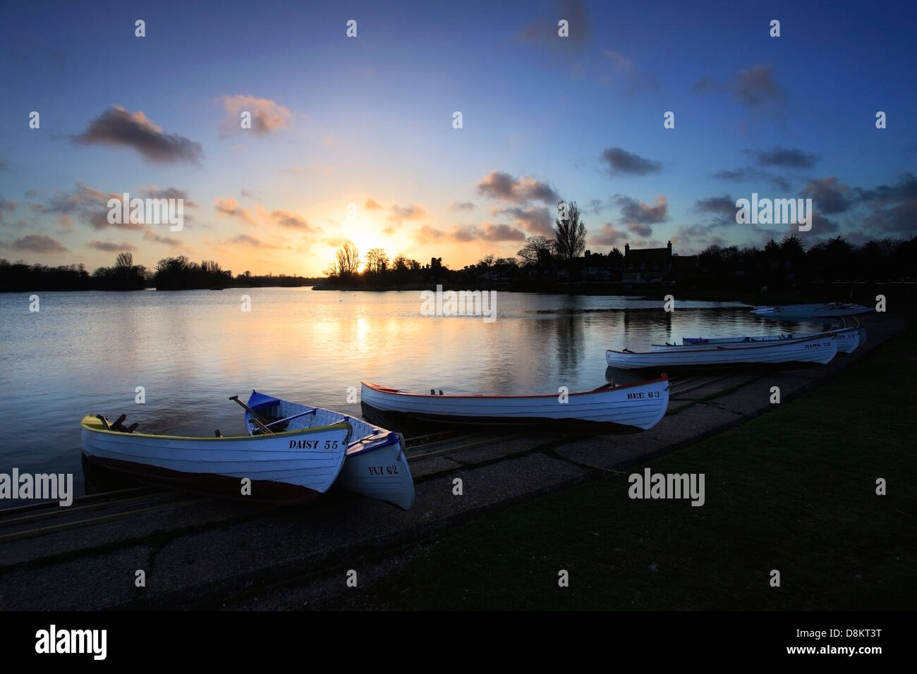 Colourful wooden rowing boats for hire on the Mere lake, Thorpeness ...