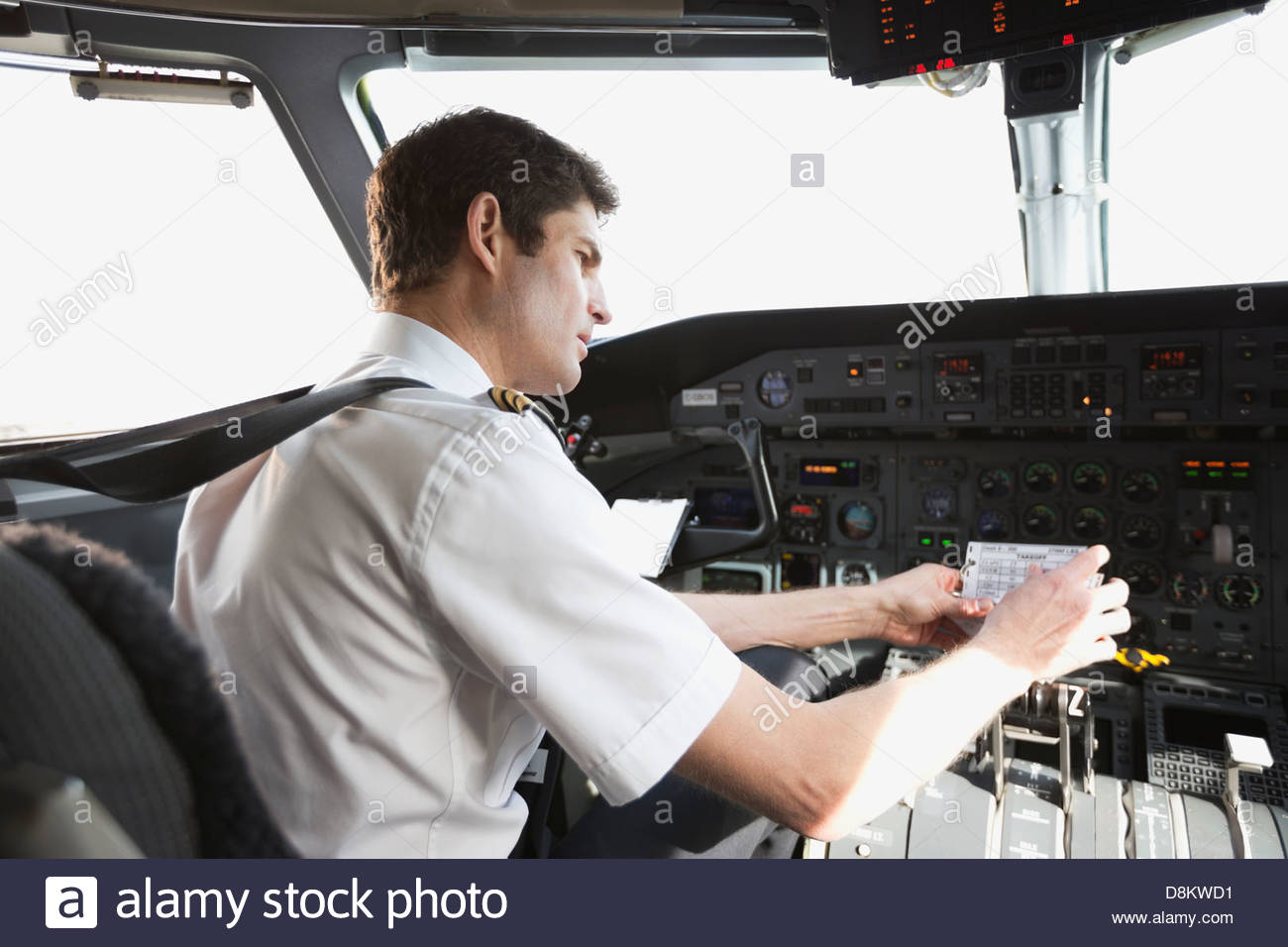 Commercial pilot in cockpit hi-res stock photography and images - Alamy