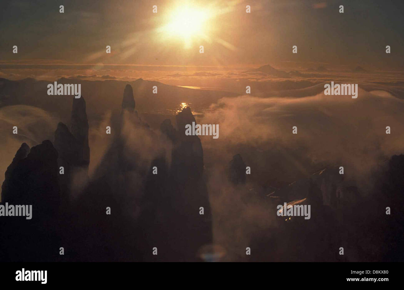 The misty Aghileen Pinnacles, sharp mountain peaks rising through fog ...