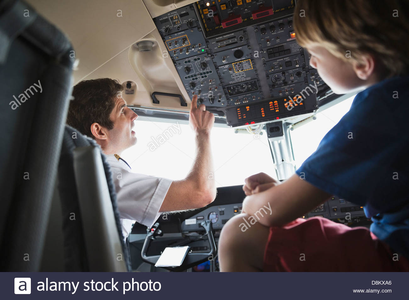 Male pilot explaining control panel hi-res stock photography and images ...
