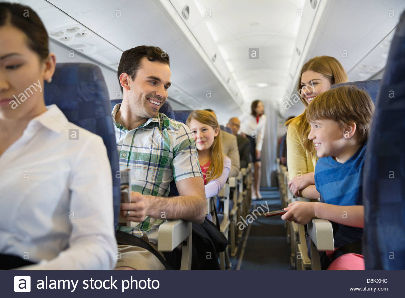 Young adult smiling airplane hi-res stock photography and images - Alamy