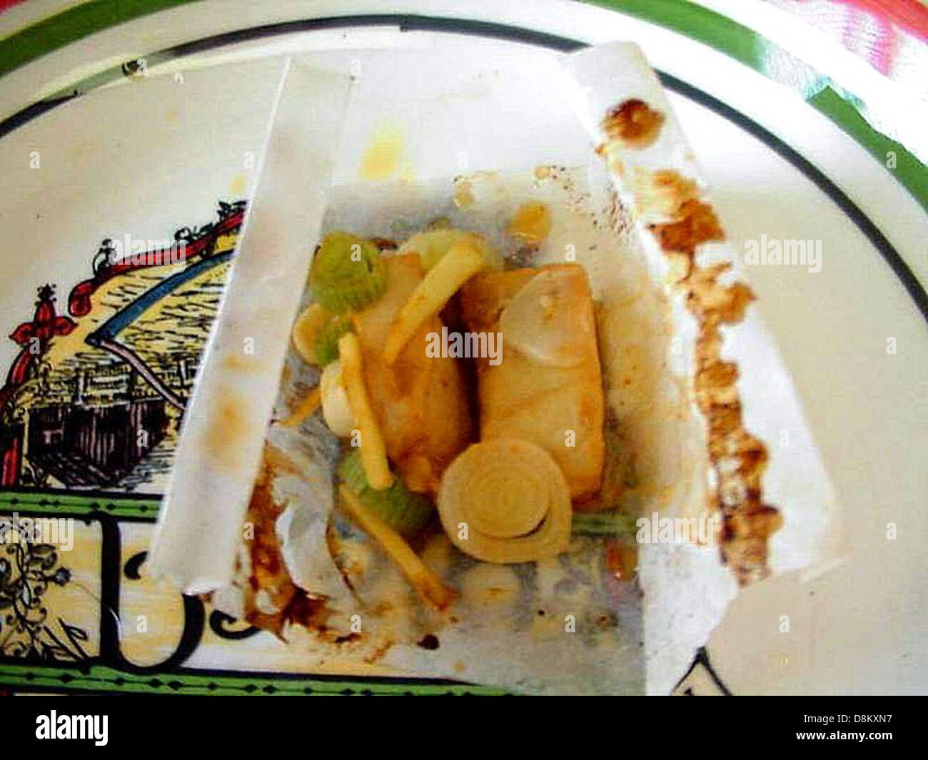 A piece of tuna fish is delicately baked in parchment paper, retaining ...