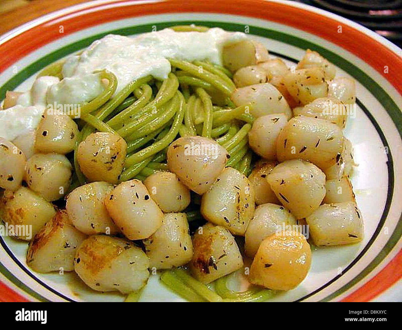 A plate of scallops served with seafood pasta, a delicious and elegant ...