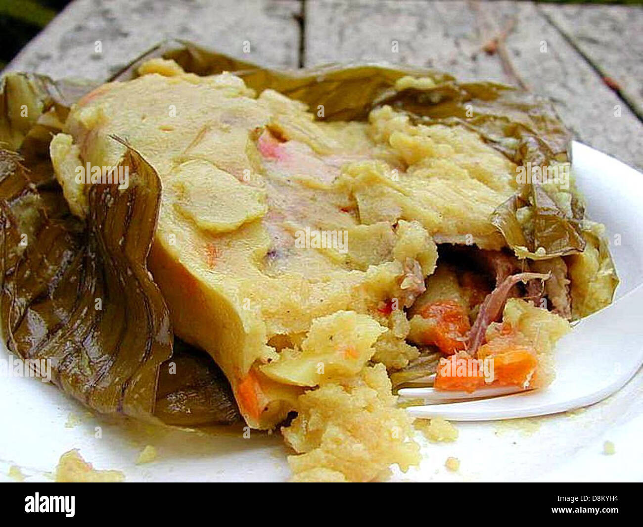 A close-up image of tamales, a traditional Latin American dish made of ...
