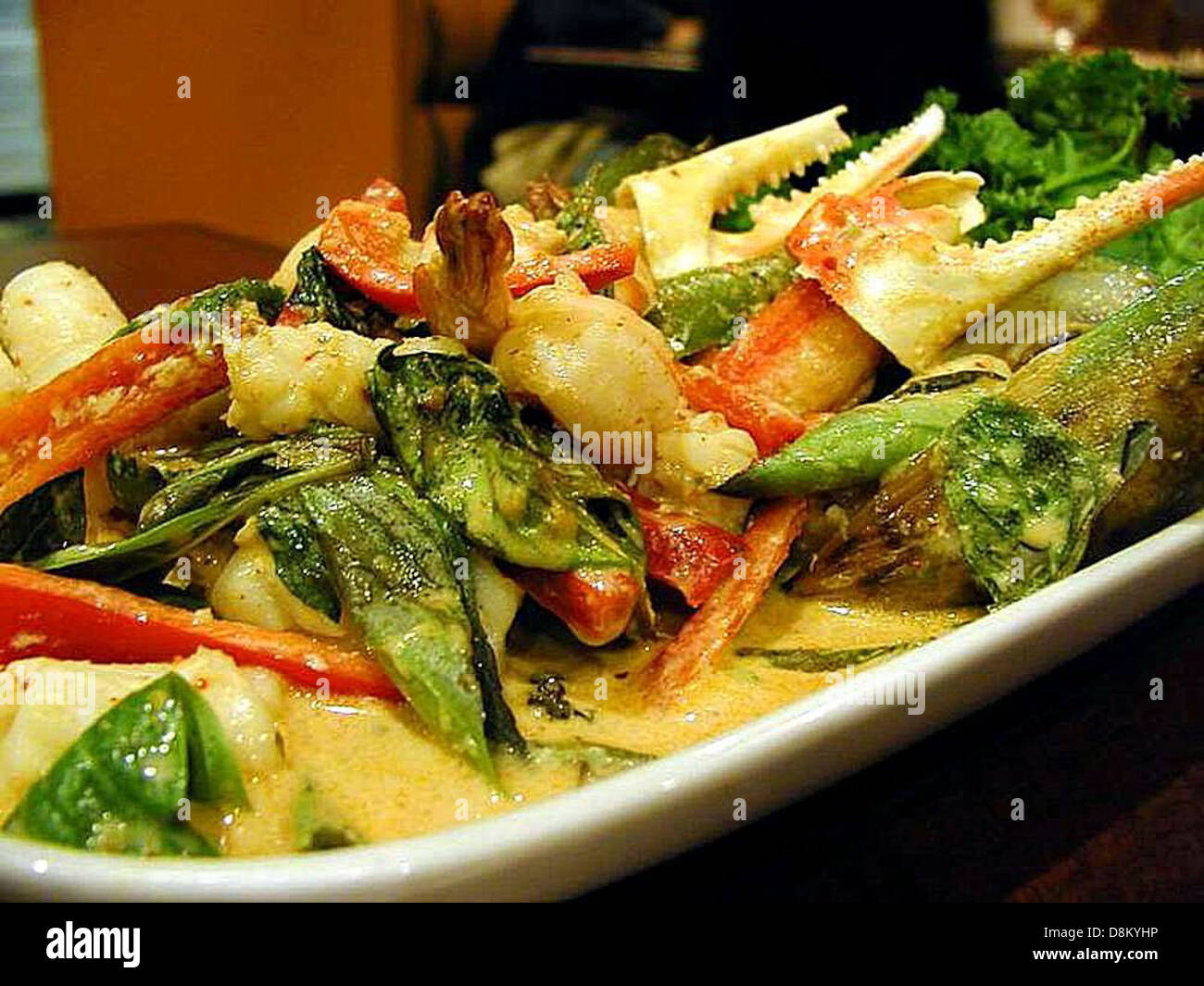 A dish featuring crab claws cooked with basil, a popular Thai food ...