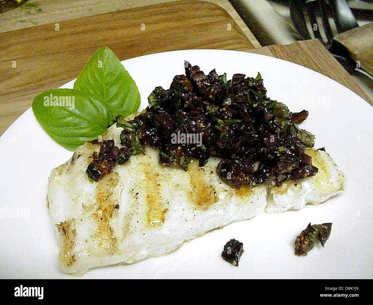 A Thanksgiving dish featuring grilled cod served with a fig tapenade ...