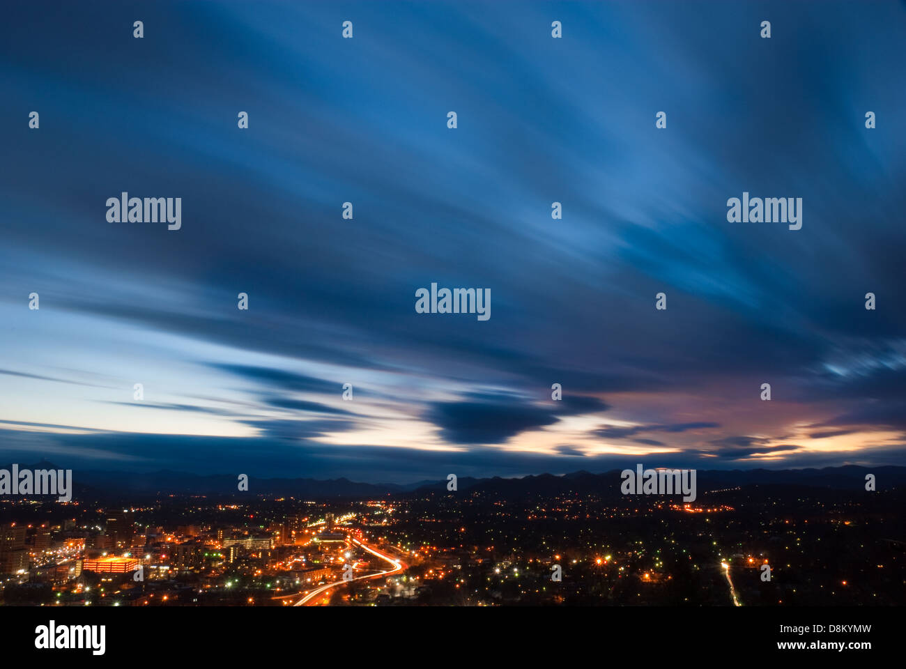 Asheville, North Carolina glowing under a dramatic sky at dusk Stock ...