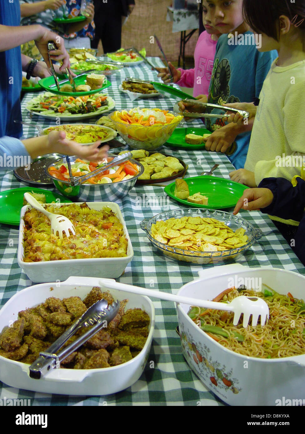 A variety of vegetarian dishes displayed on a buffet table, offering a ...