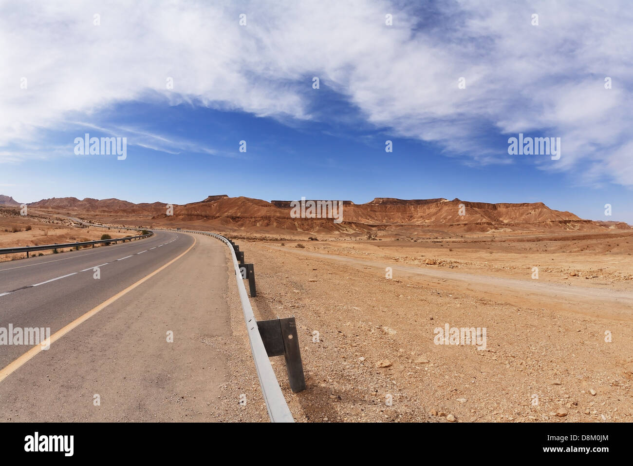 Highway in orange stone desert Stock Photo - Alamy