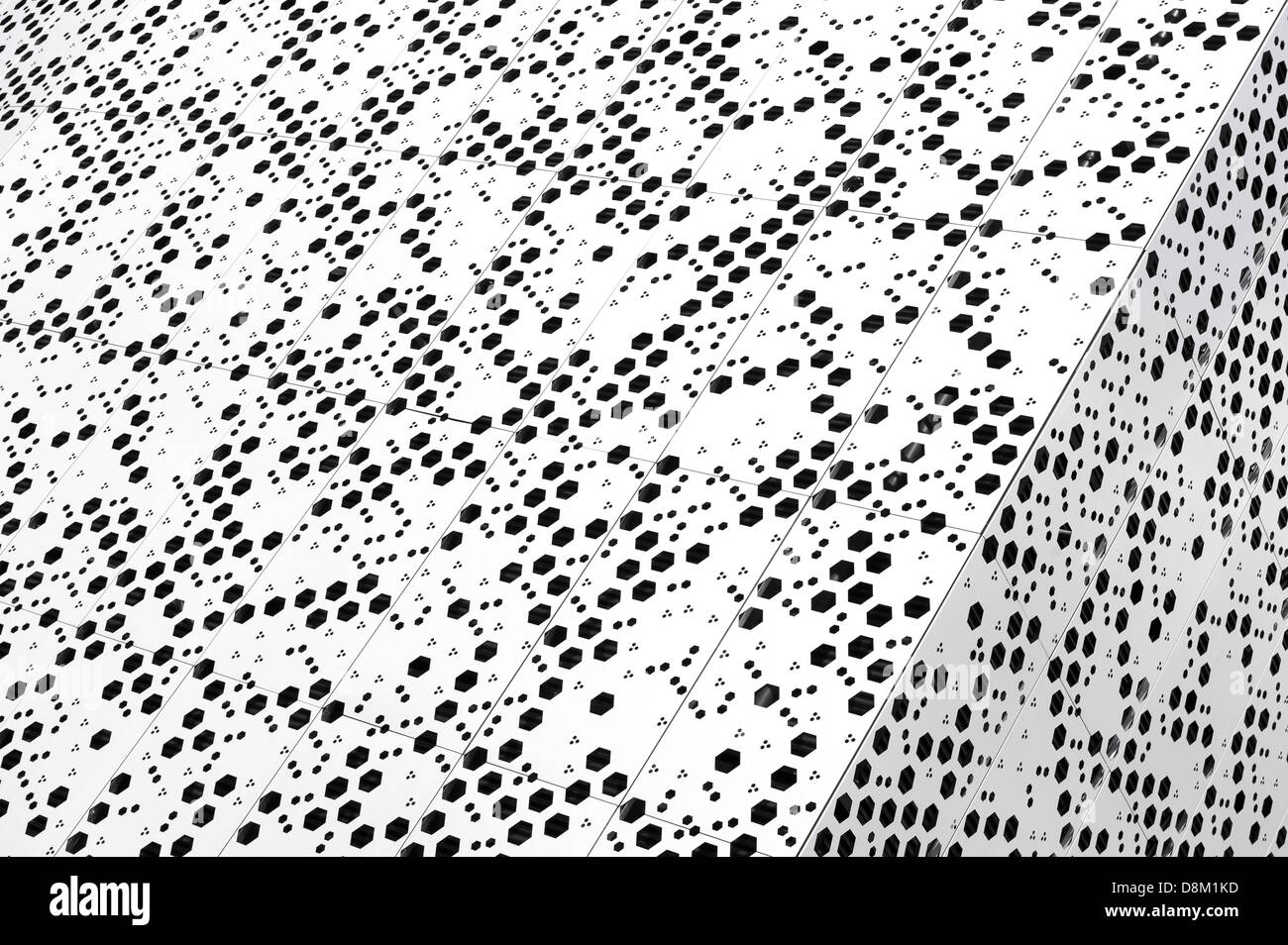 White metal facade with hexagonal perforations Stock Photo - Alamy