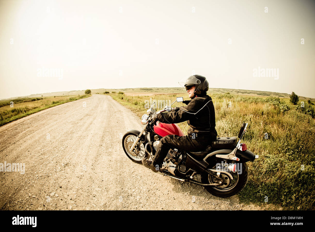 Biker on the country road Stock Photo - Alamy