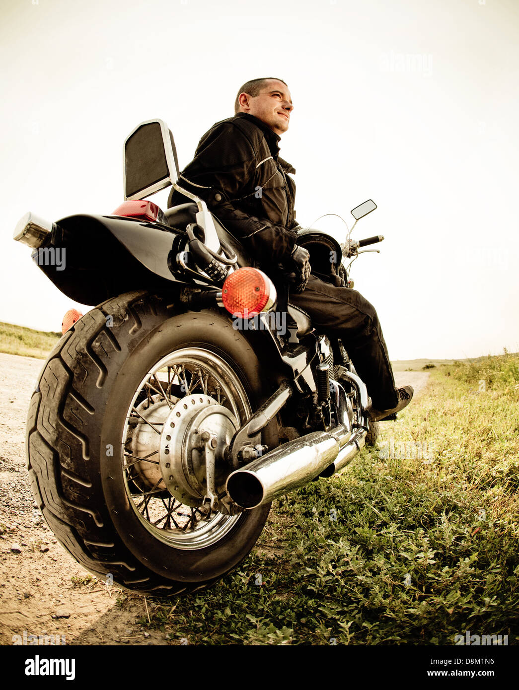 Biker on the country road Stock Photo - Alamy