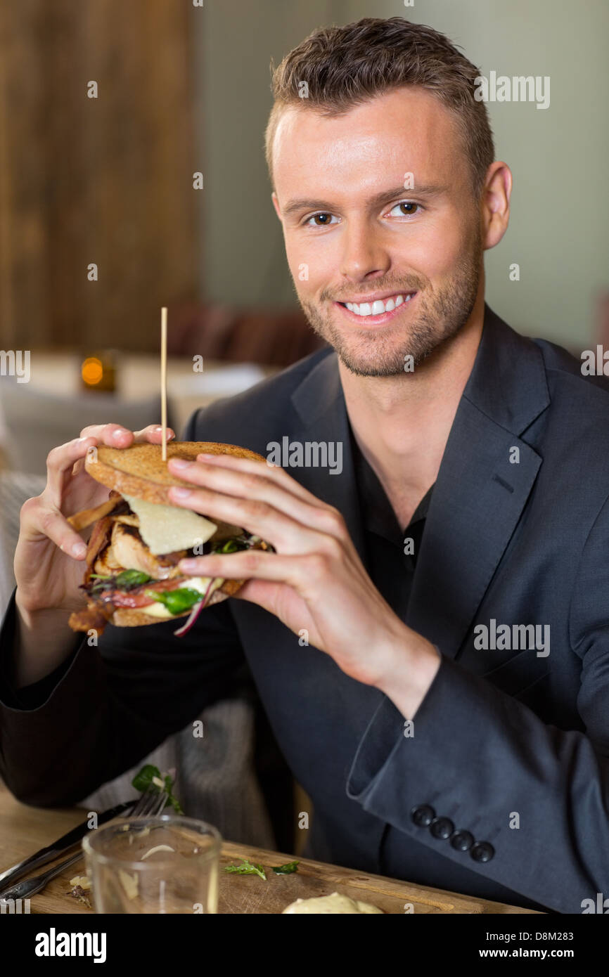 Business man holding sandwich hi-res stock photography and images - Alamy
