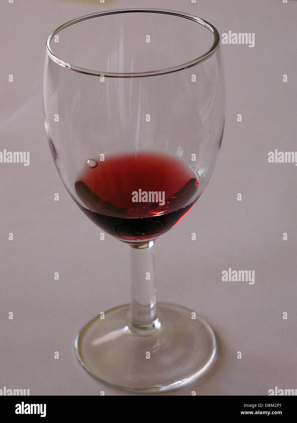 A hollow wine glass, typically used for serving wine, featuring a ...