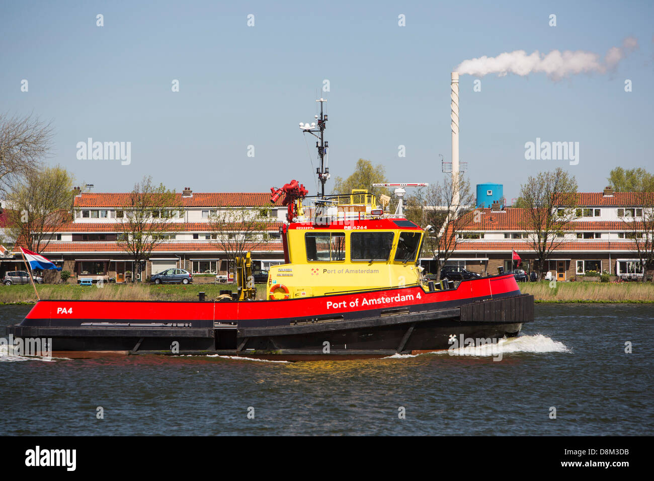 A pilot boat on a canal near the docks in Amsterdam, Netherlands Stock ...