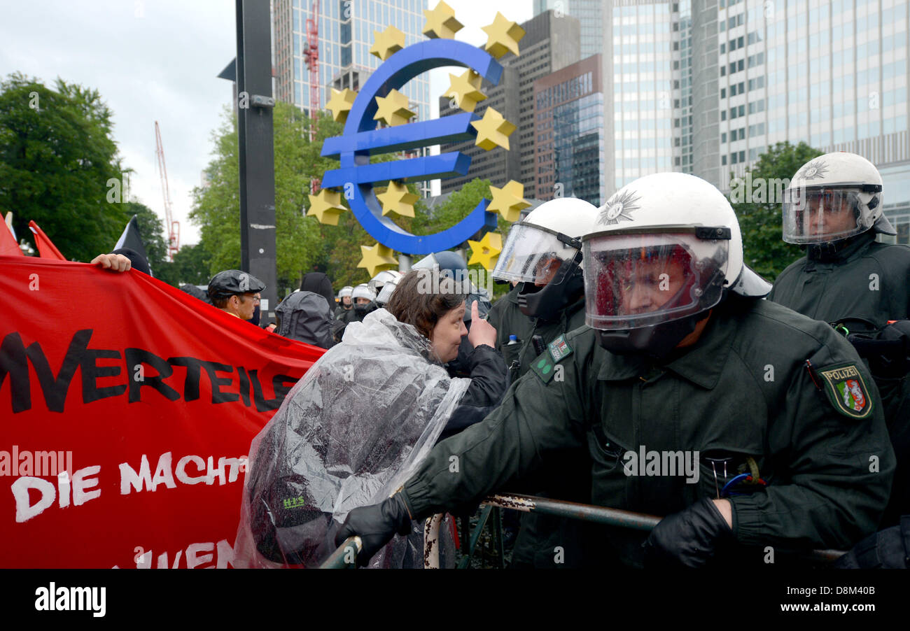 Activists of the blockupy movement shake a police barricade in front of ...