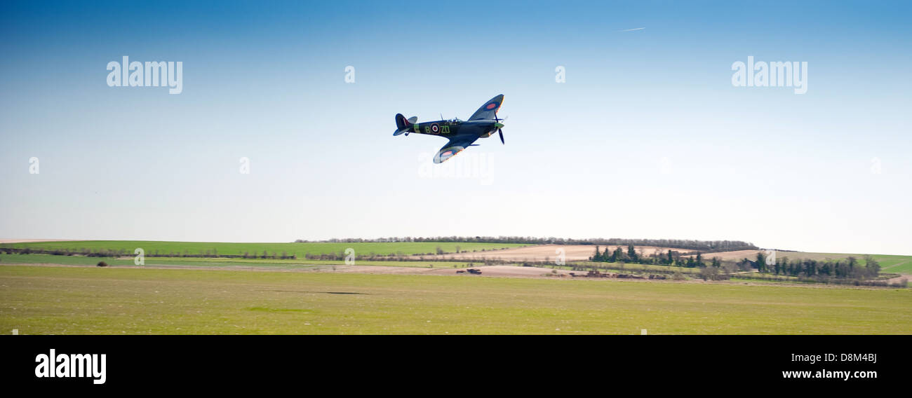 A Supermarine Spitfire flying over Duxford Aerodrome,Cambridgeshire ...