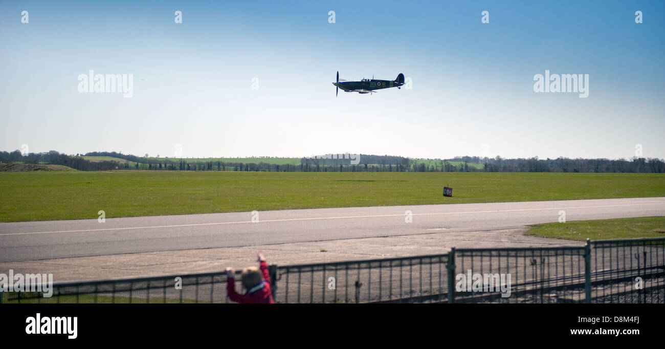 A Supermarine Spitfire flying over Duxford Aerodrome,Cambridgeshire ...