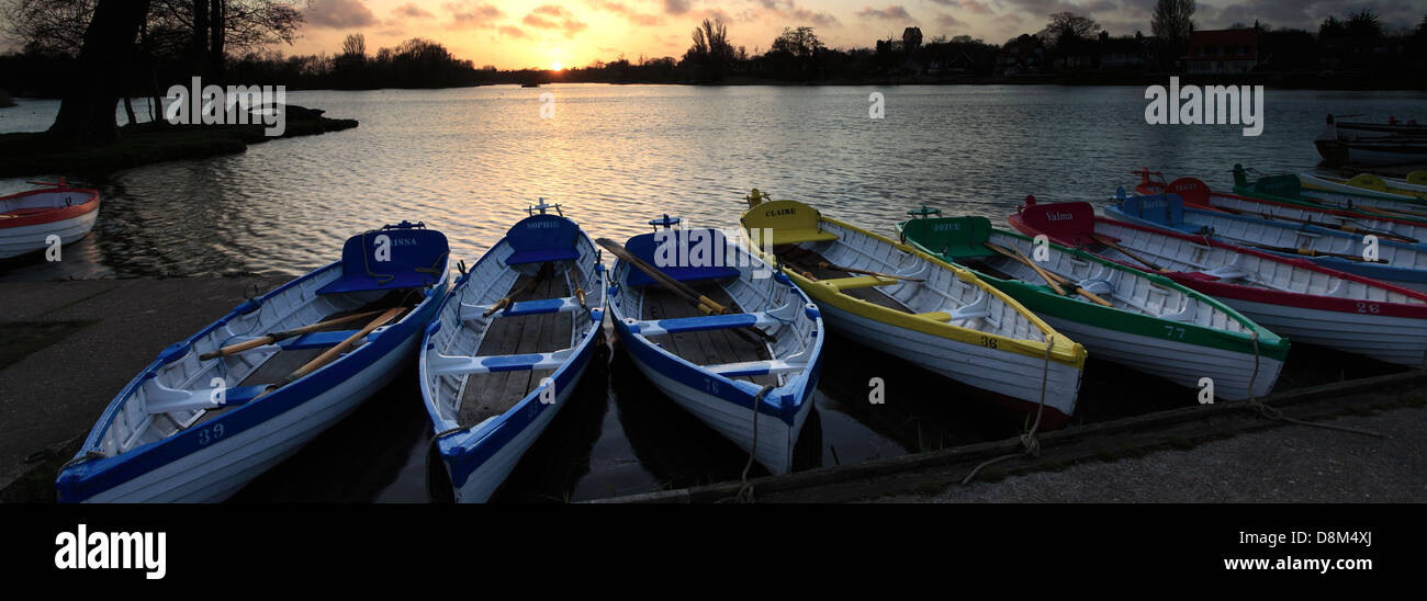 Colourful wooden rowing boats for hire on the Mere lake, Thorpeness ...