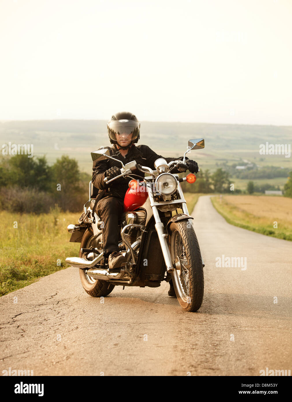 Biker on the country road Stock Photo - Alamy
