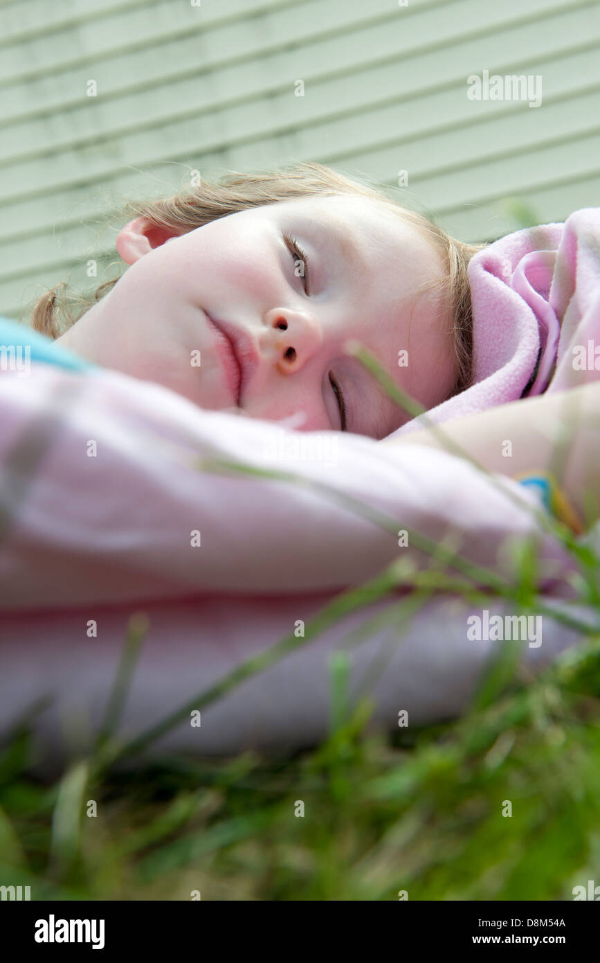 Little girl napping outdoors Stock Photo - Alamy