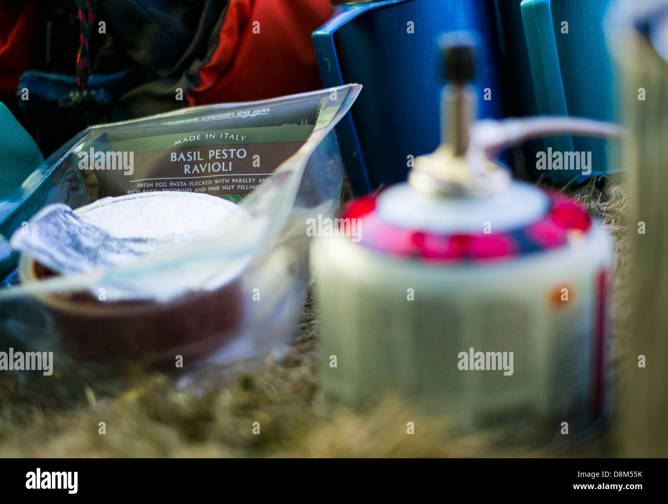 Cooking pasta on a small stove while camping wild in a tent Stock Photo ...