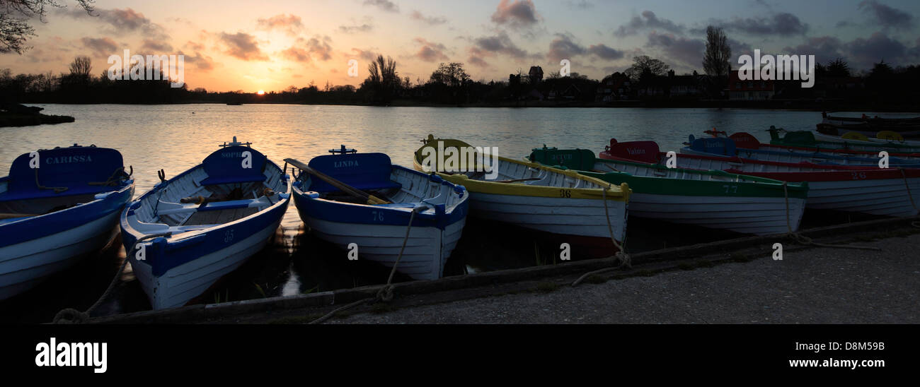 Colourful wooden rowing boats for hire on the Mere lake, Thorpeness ...