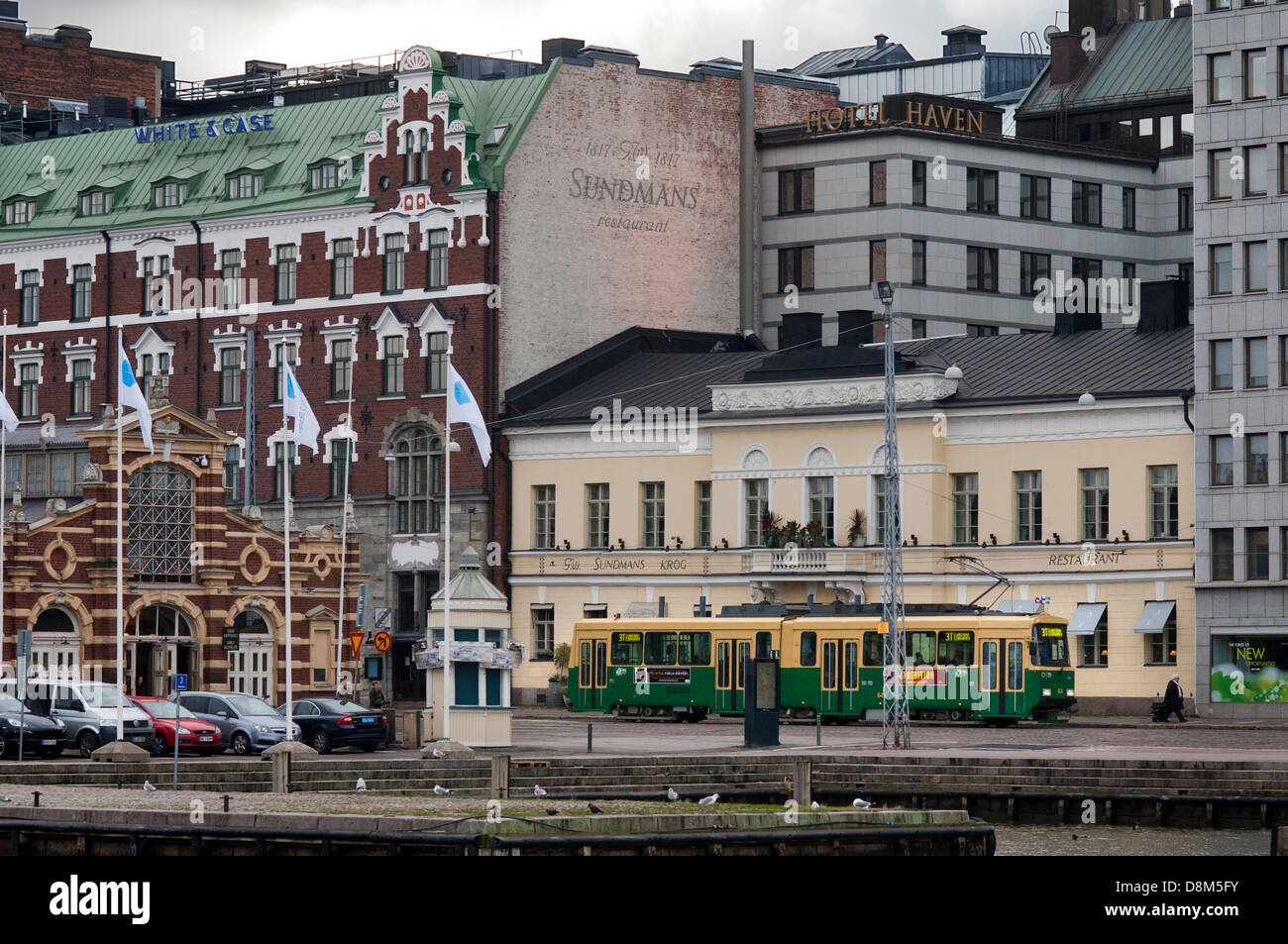 Helsinki. Genral view of the city by tram and street market Eteläranta ...